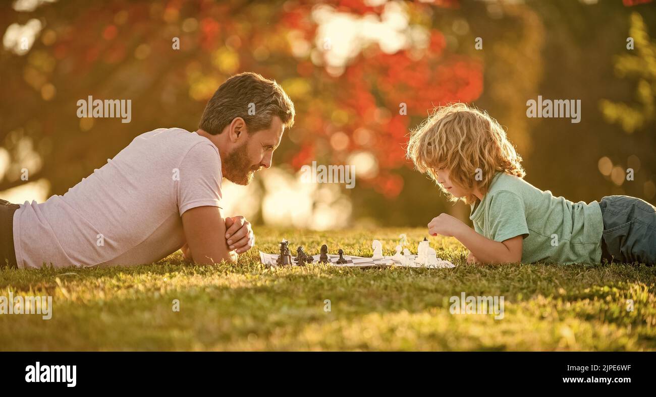 happy family. parenthood and childhood. checkmate. spending time ...