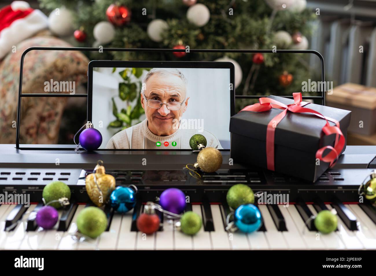 Christmas video call tablet. synthesizer, piano keys Stock Photo - Alamy
