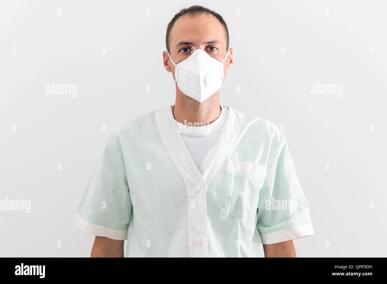 male doctor in white protective respirator close-up, concept of ...