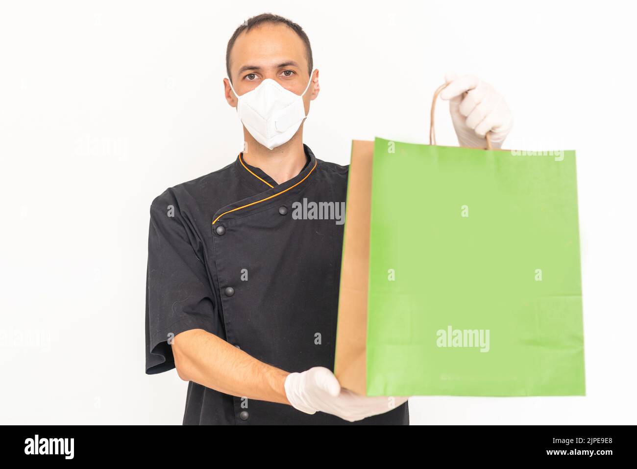 Food delivery in the restaurant. The chef packs food Stock Photo - Alamy