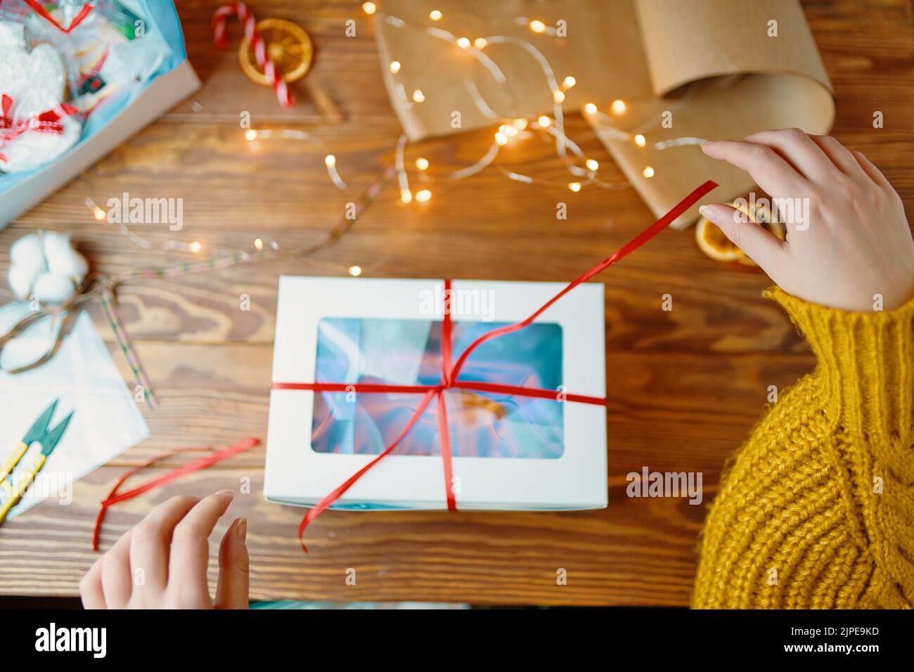 Woman's hands opening Christmas gift box Stock Photo - Alamy