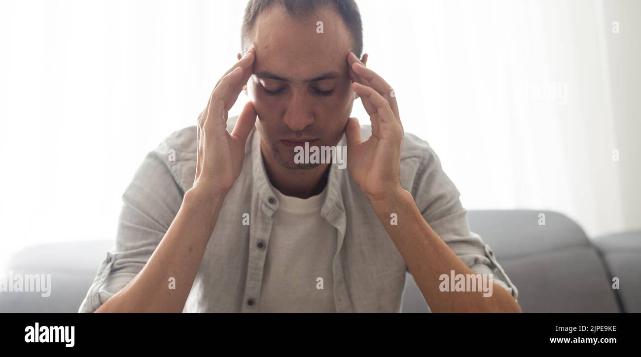Exhausted Caucasian Millennial Male Worker Take Off Glasses Massage