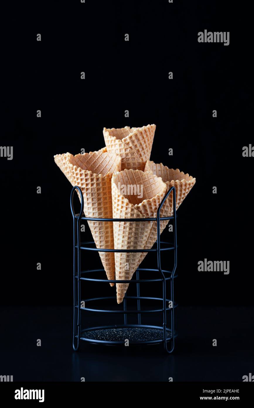 Empty Ice Cream Cones on a black background Stock Photo - Alamy