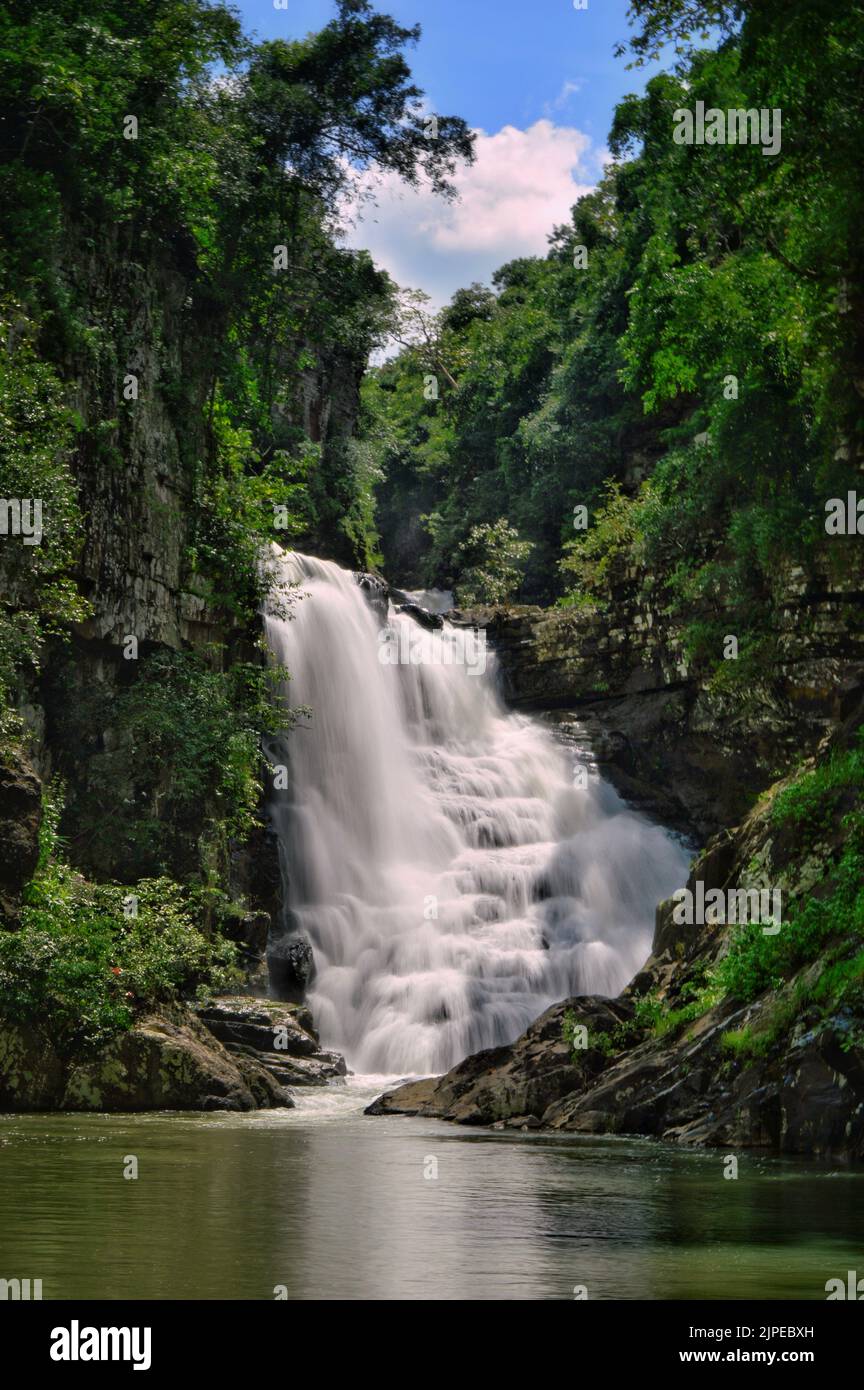 A vertical shot of a beautiful waterfall in Kanger Valley National Park ...