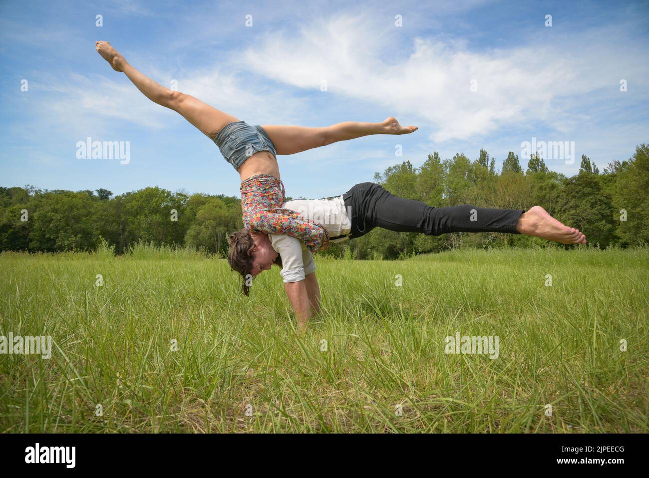 caucasian couple doing stunts on nature in France Stock Photo - Alamy