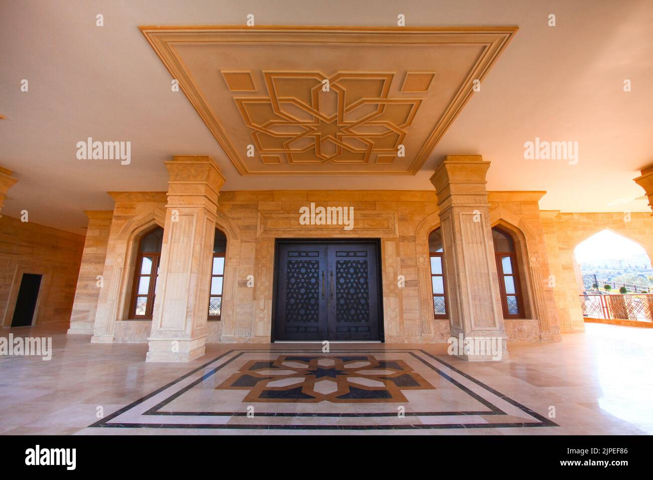 A beautiful interior of a mosque with columns and carved details Stock ...