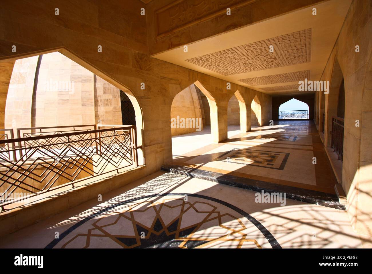 A mosque interior with arches and tiled floor Stock Photo - Alamy