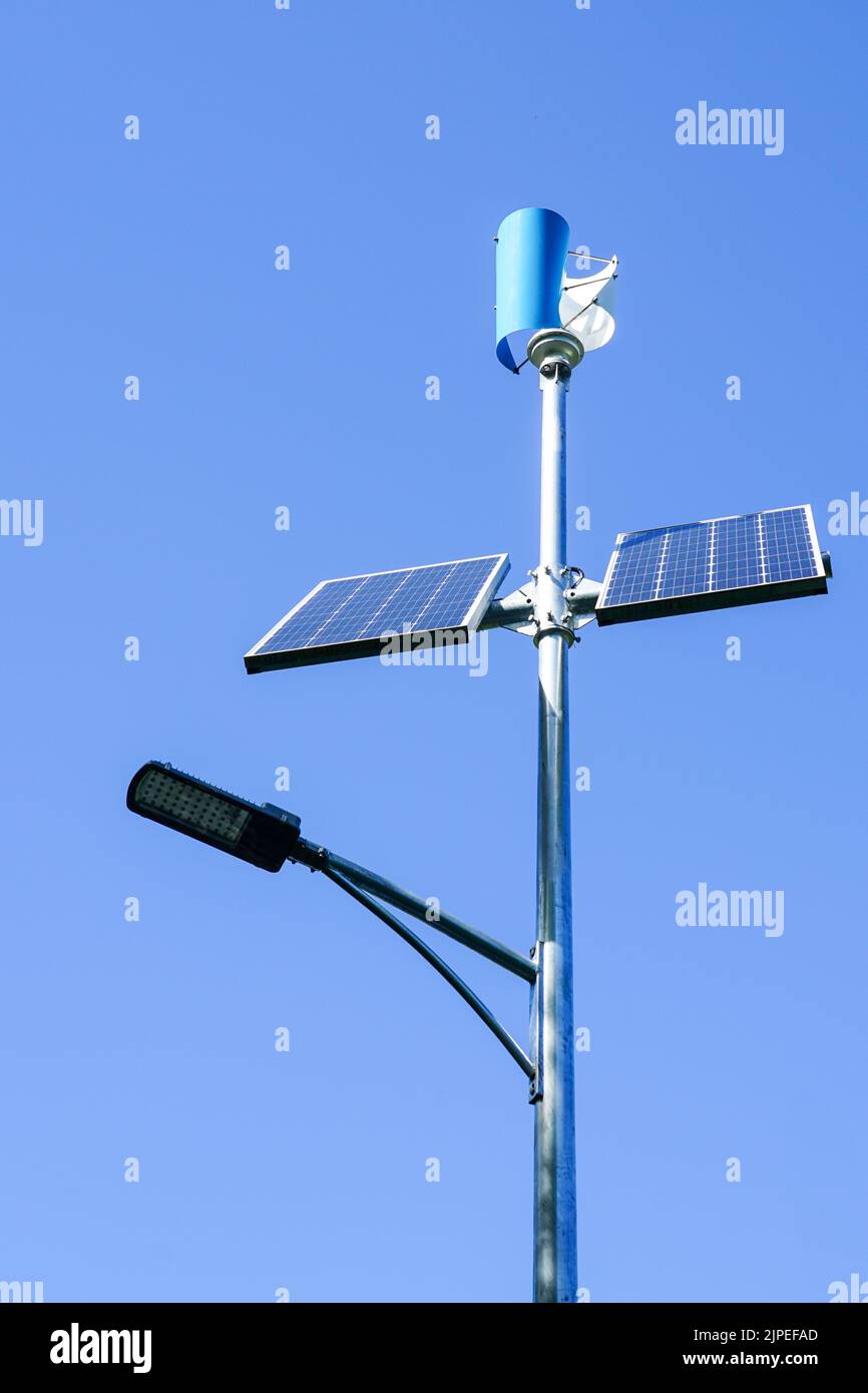 Pole with innovative LED street light powered by solar cells and small ...