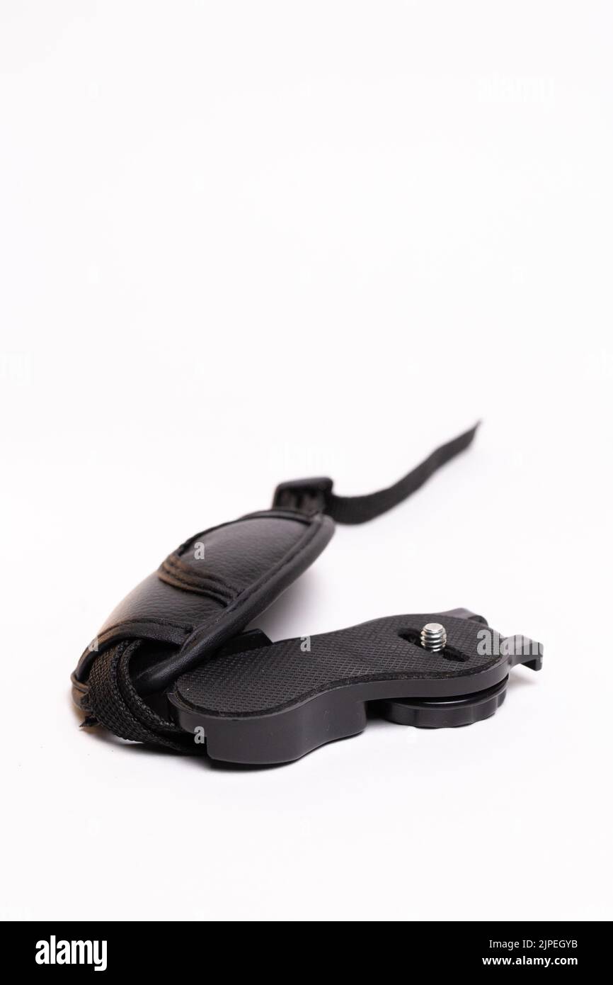 black leather camera strap on white background Stock Photo - Alamy