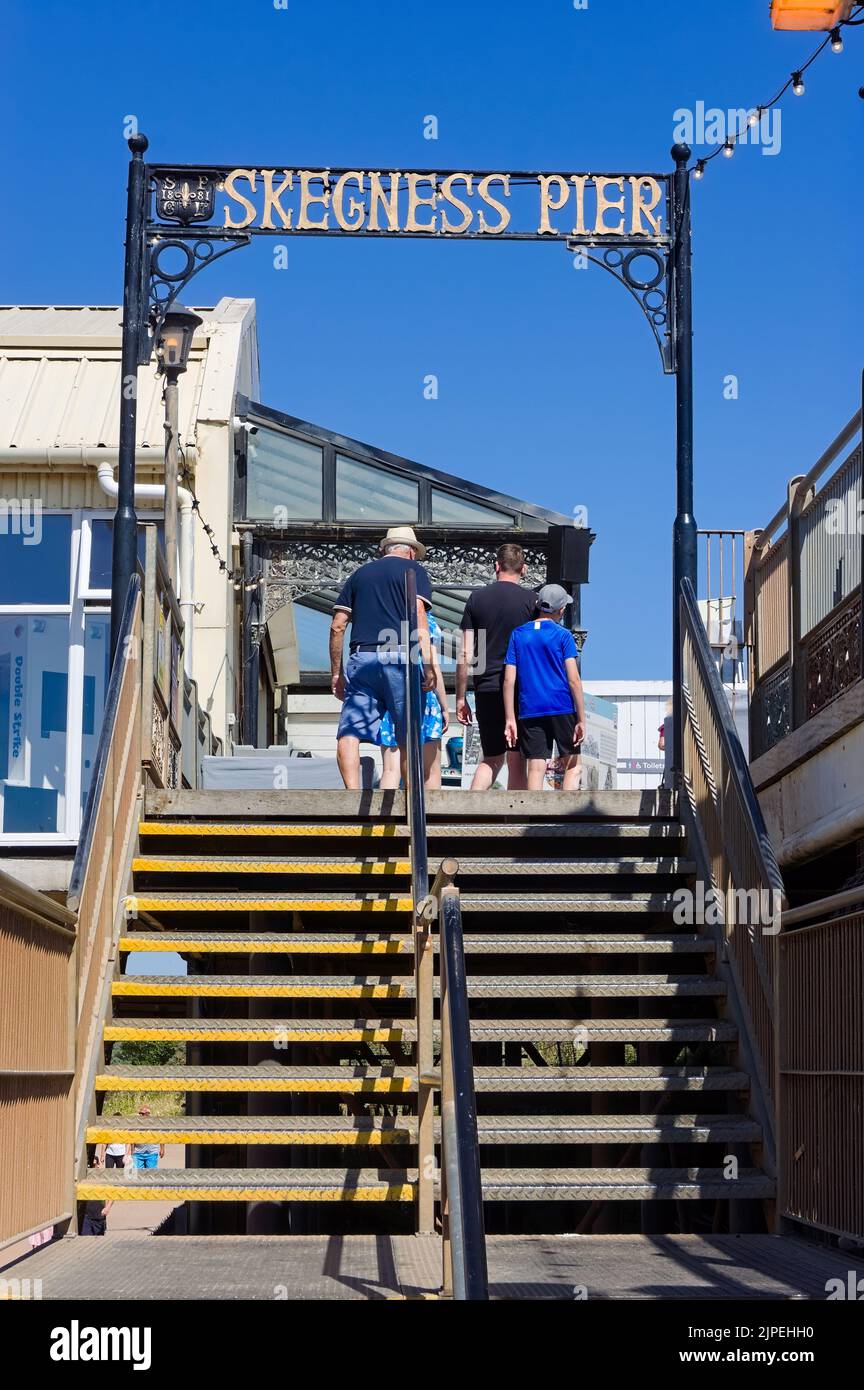 Steps up the pier with people on a sunny day in Skegness Stock Photo ...