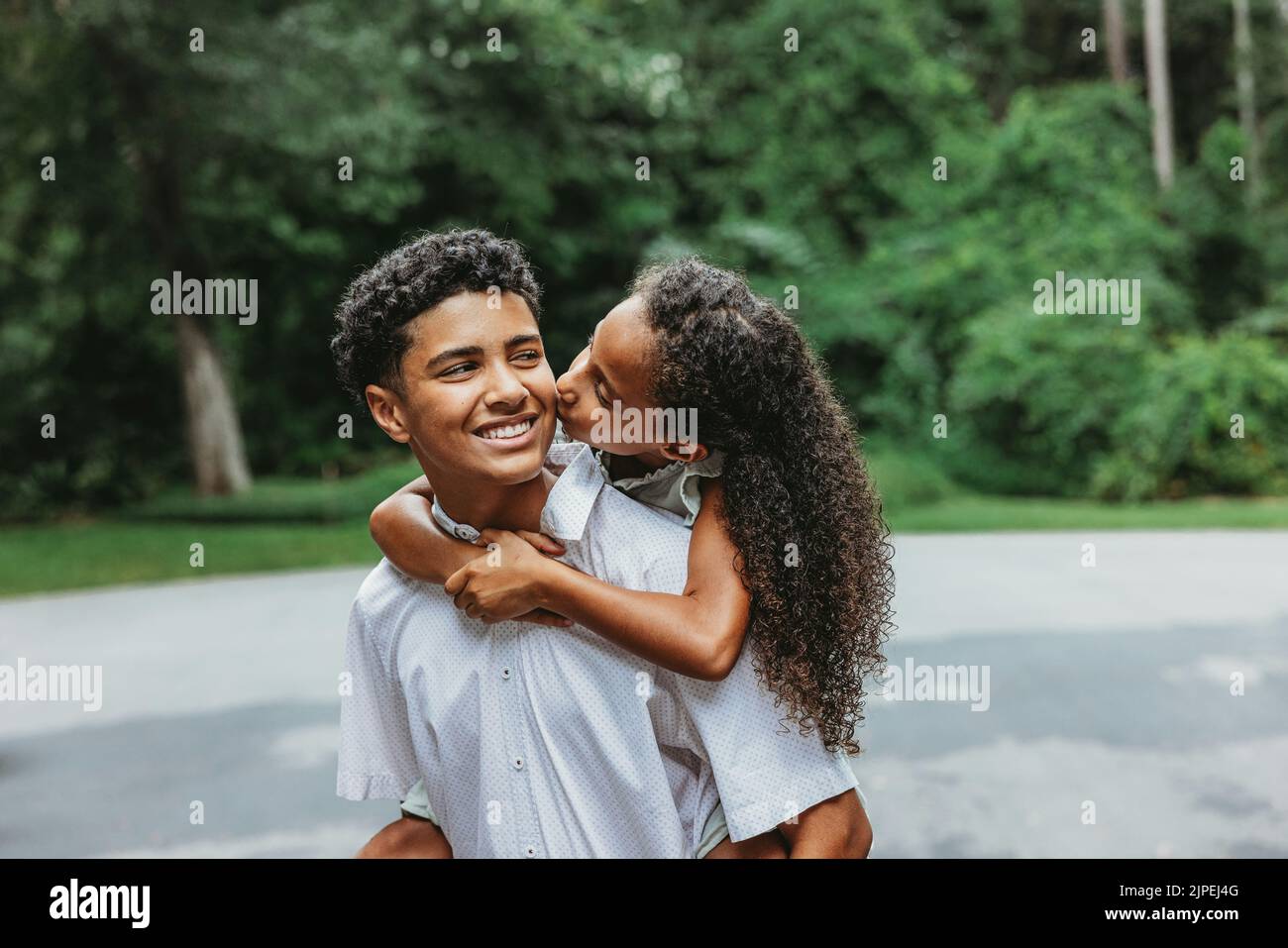 Teens On The Cheek Kiss