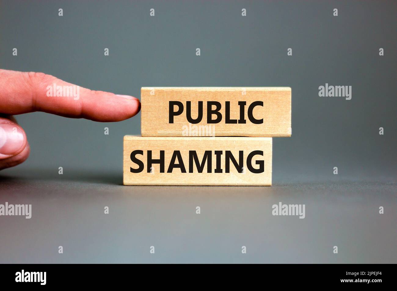 Public shaming symbol. Concept words Public shaming on wooden blocks on ...