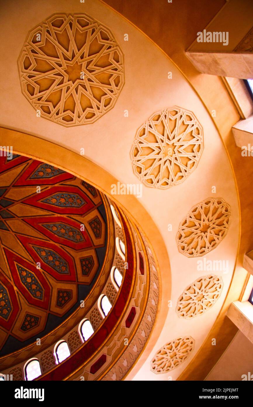 A vertical shot of a mosque ceiling with beautiful traditional carved ...