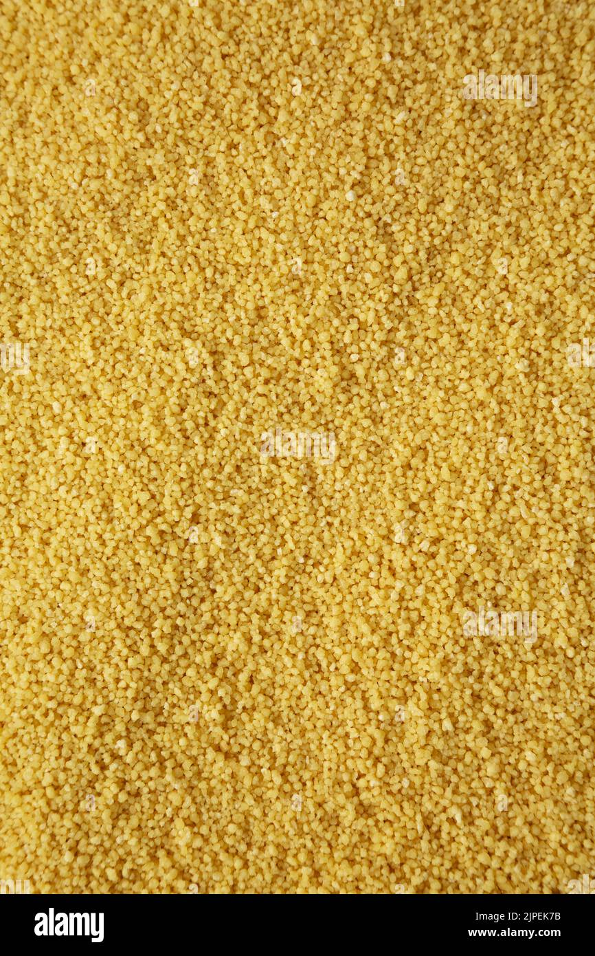 Raw organic couscous background Stock Photo - Alamy