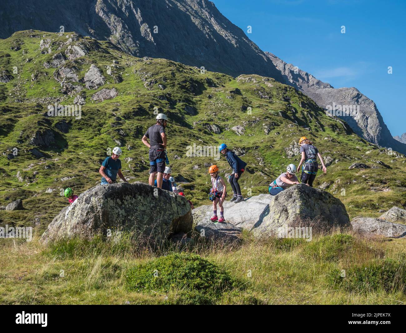 The image is of a group of young people undertaking a learn how to walk ...