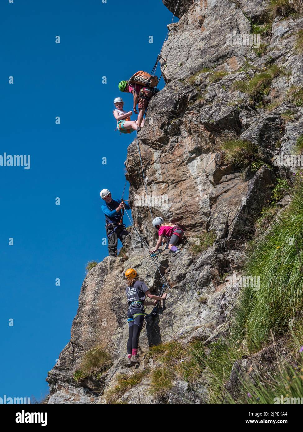 The image is of people on the Klettersteig climb near the Franz Senn ...