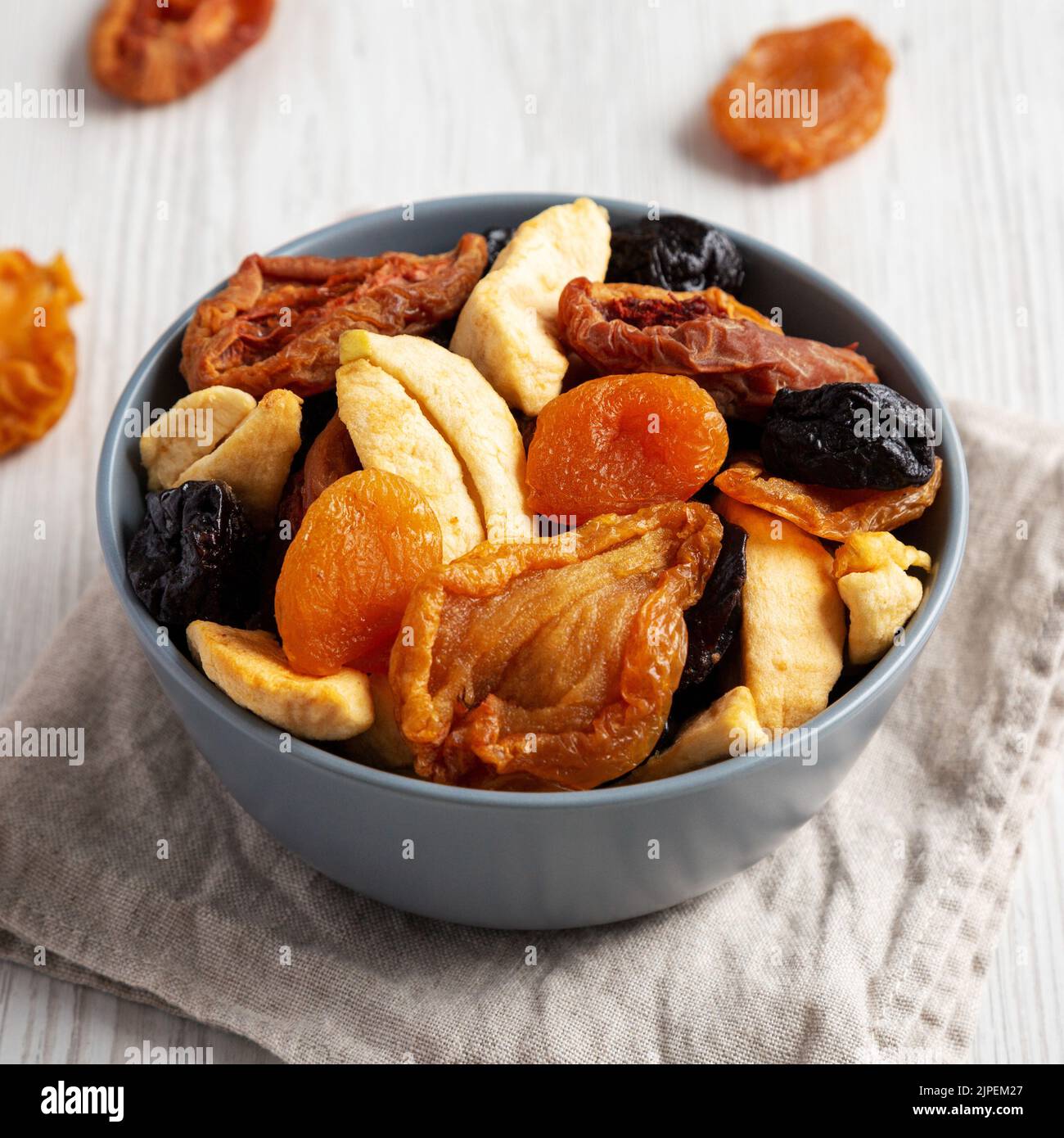 Organic healthy fruit mix in a bowl, side view Stock Photo - Alamy