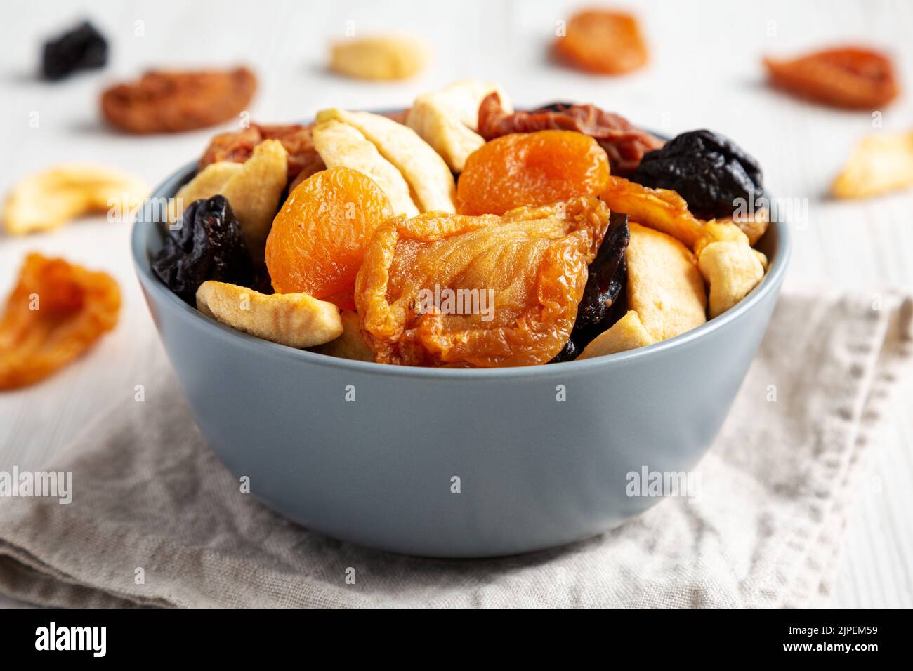Organic healthy fruit mix in a bowl, side view. Close-up Stock Photo ...