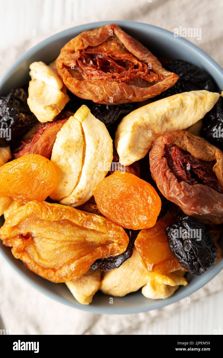 Organic healthy fruit mix in a bowl, top view. Flat lay, overhead, from ...