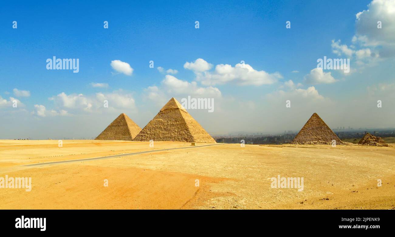 A beautiful view of a desert with Pyramids under the blue sky Stock ...