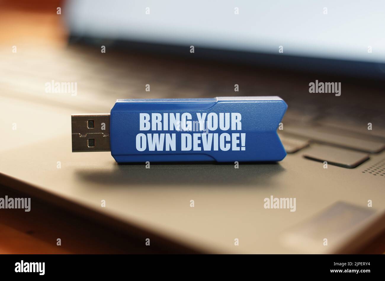 Computer and security concept. On the laptop keyboard is a flash drive ...