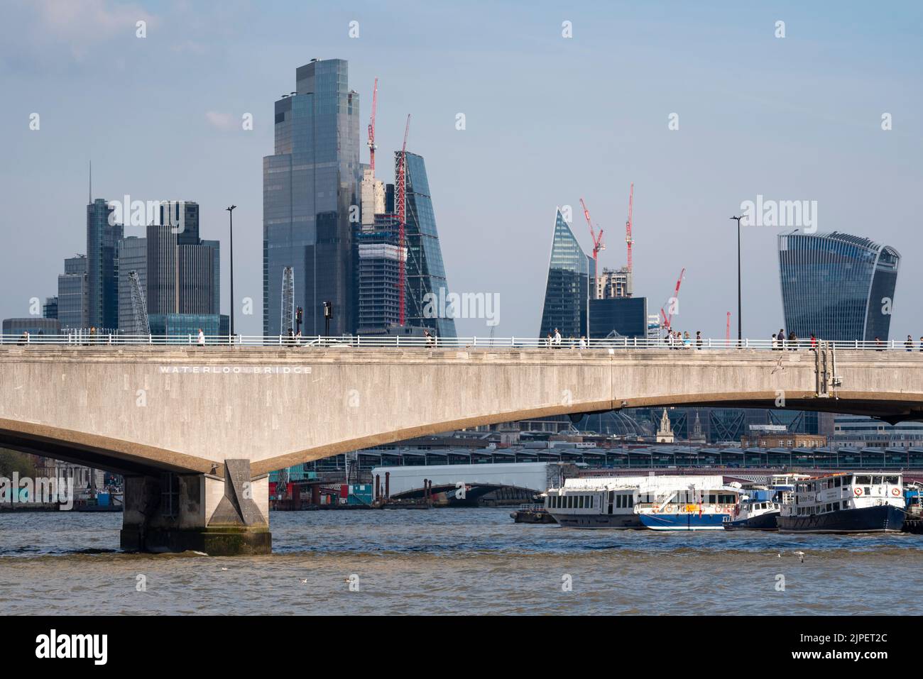 Waterloo Bridge in London over the River Thames, with the skyscrapers ...