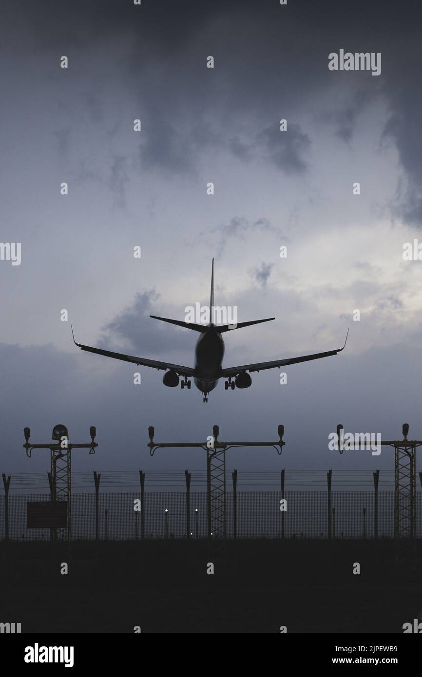 A vertical shot of an airplane in movement flying to its destination ...