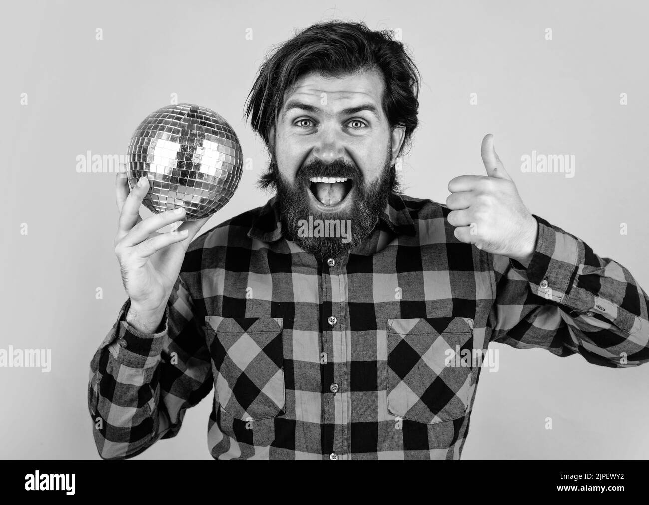 happy man celebrating party with disco ball and showing thumb up, lets ...