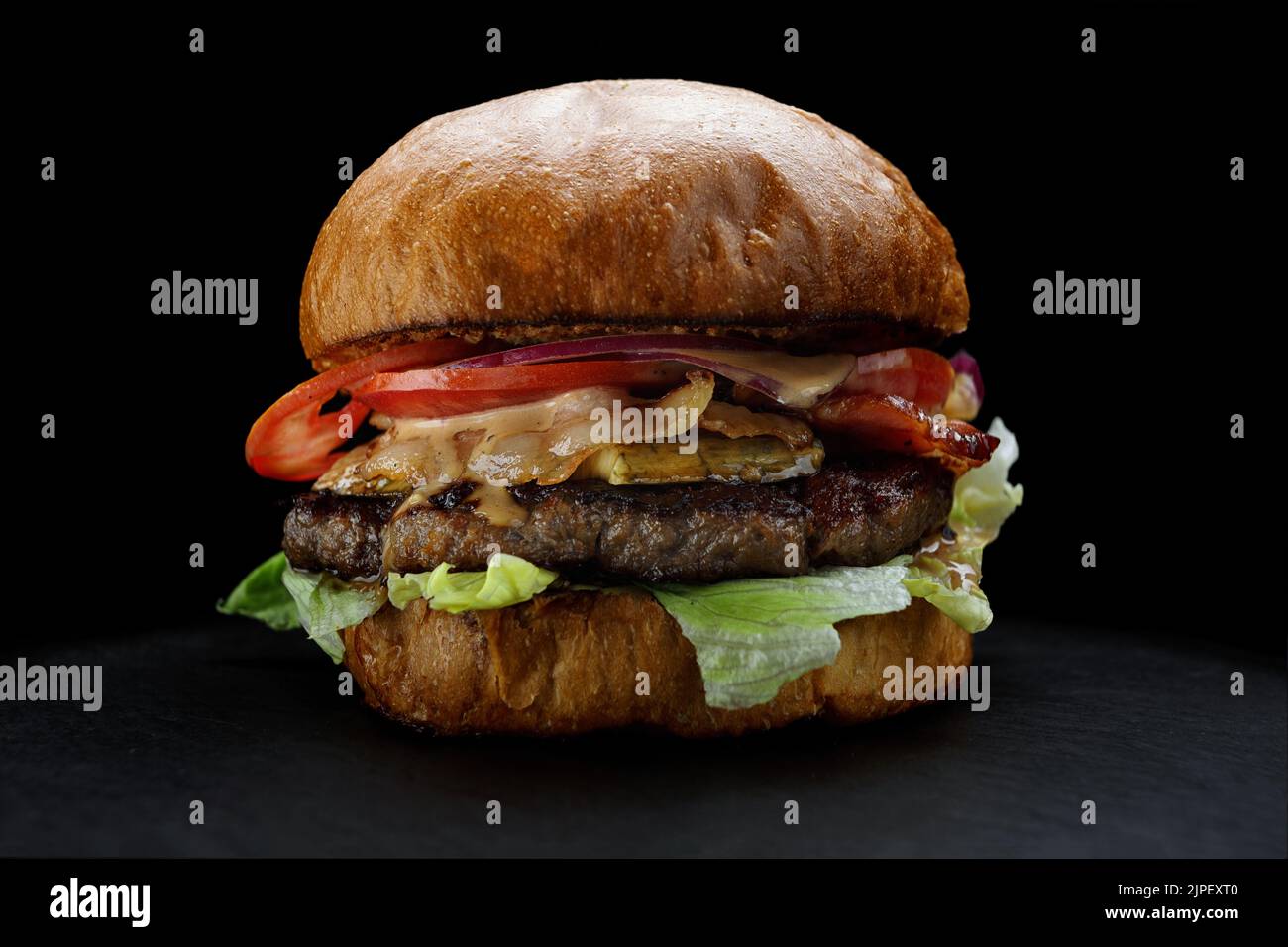 Burger with beef and cottage cheese on a black background, Horizontal ...