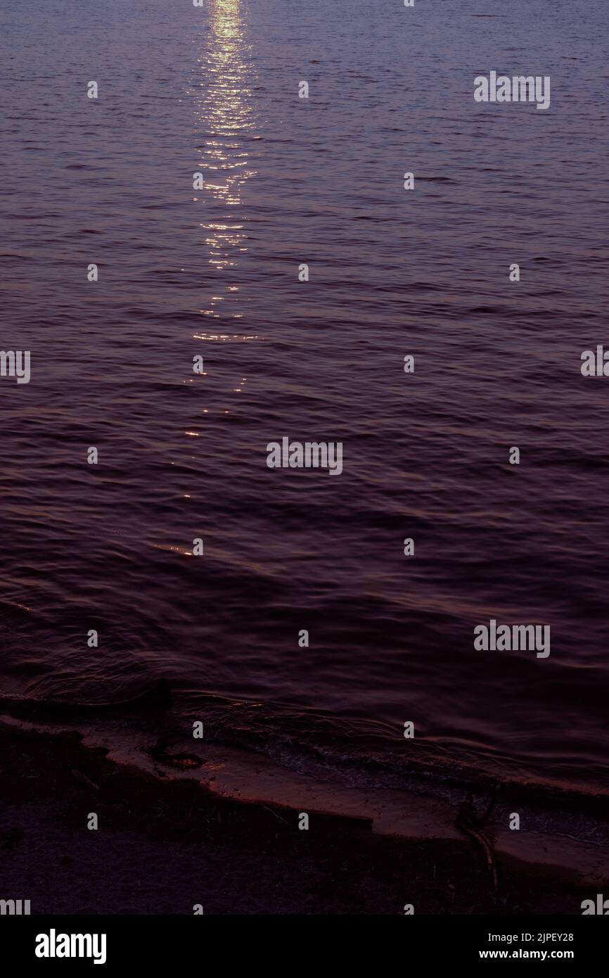 purple blue waters at sunset Stock Photo - Alamy