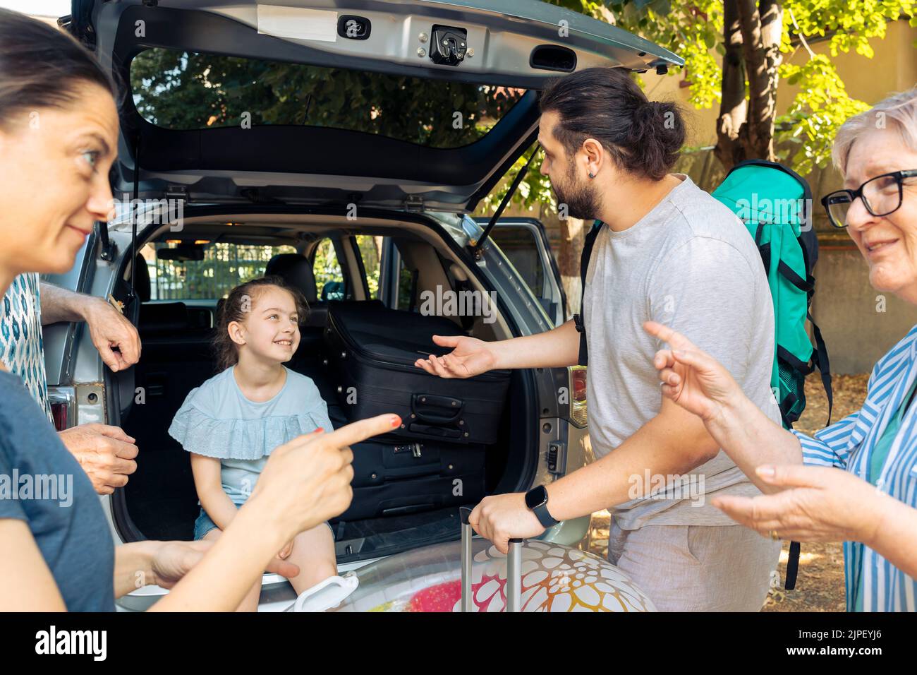 European family going on vacation journey, loading baggage and ...