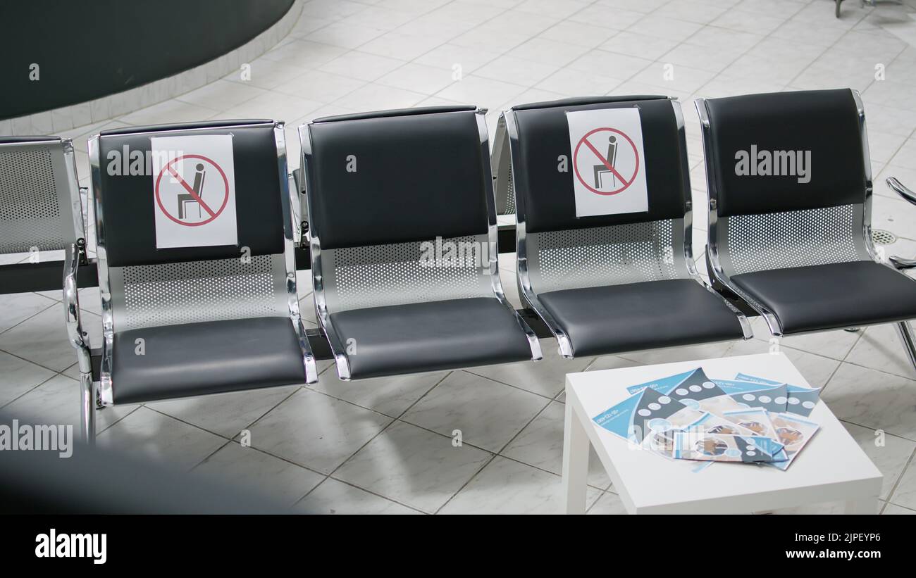 Nobody sitting on empty chairs at facility waiting room area during ...