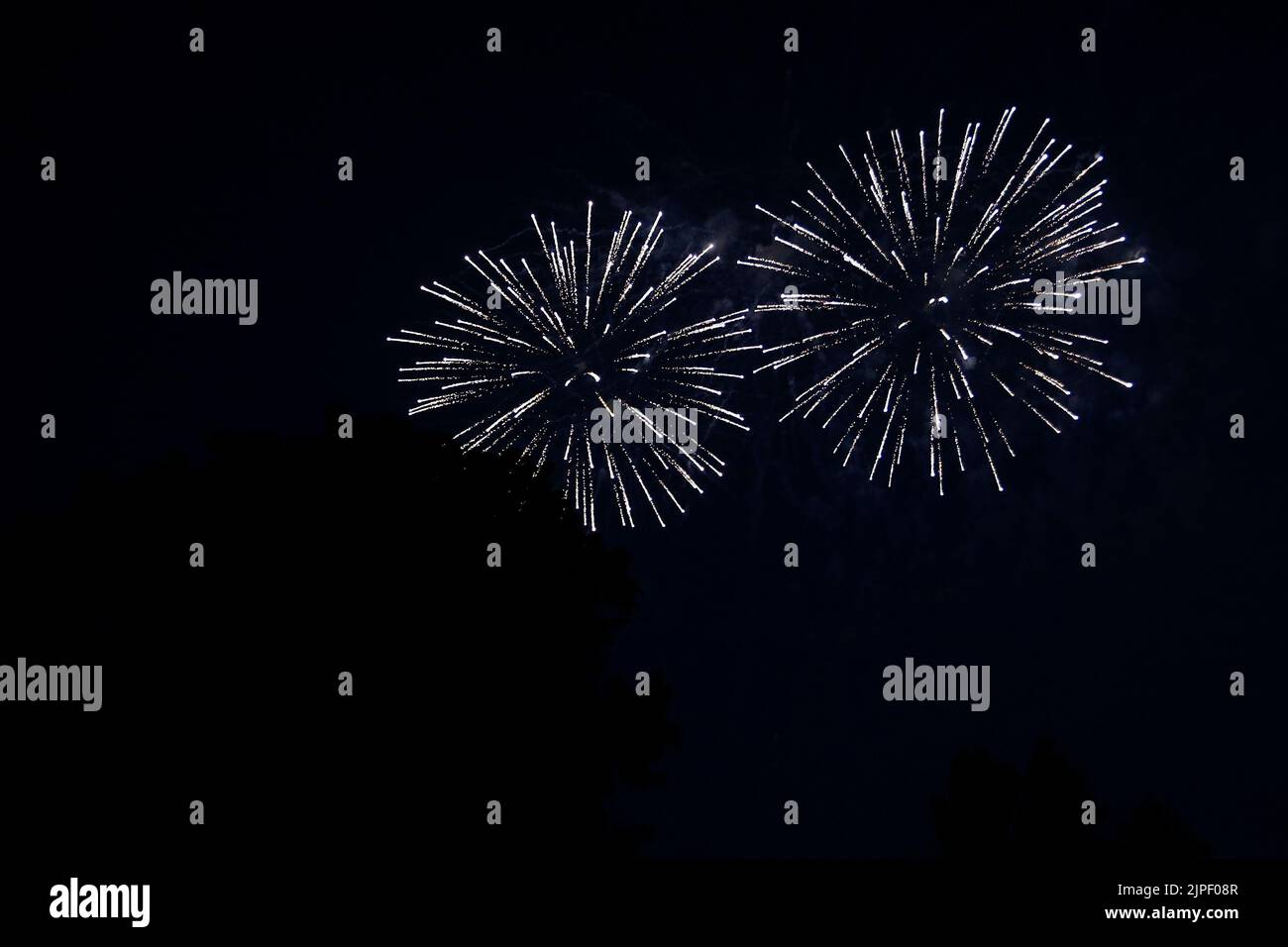 A firework display signifies the start of the Illuminated Parade part ...