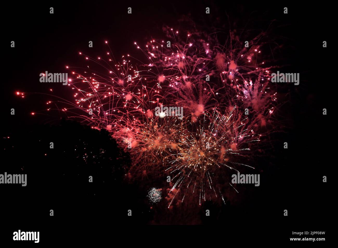 A firework display signifies the start of the Illuminated Parade part ...