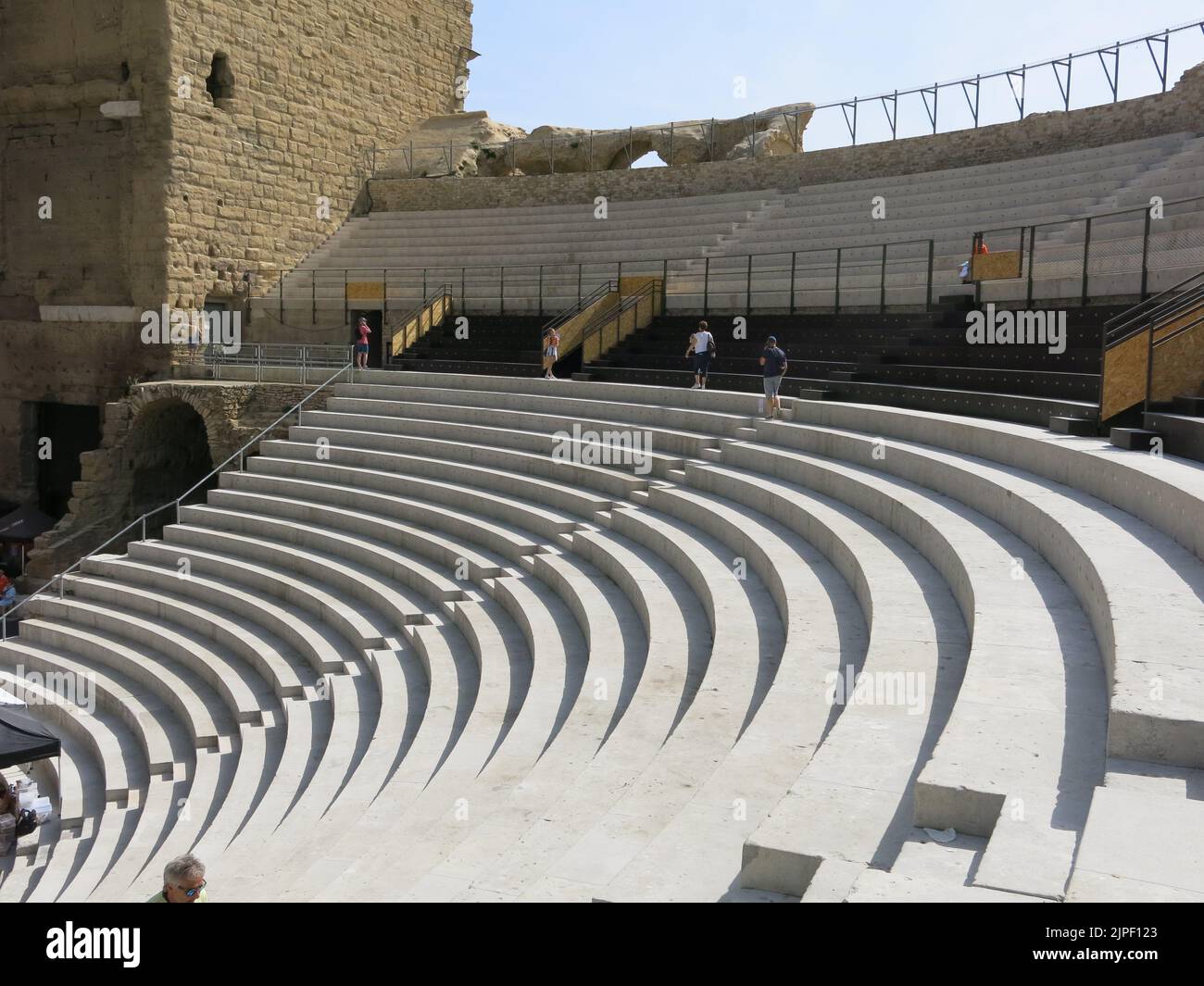 View of the steep stone seating at the outdoor auditorium of the ...