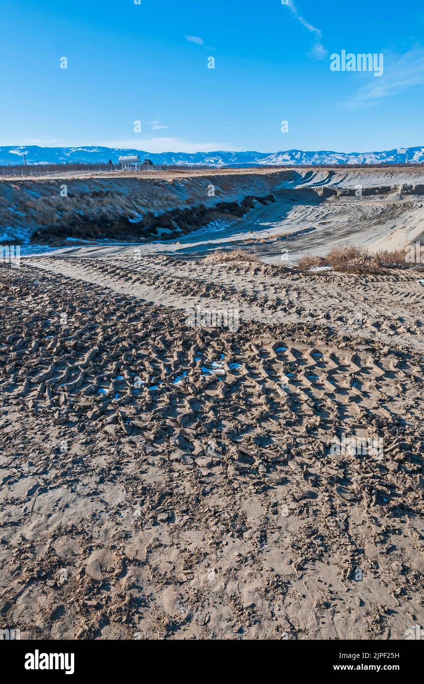 Tire and tread tracks are quite evident in the soil of an active solid ...