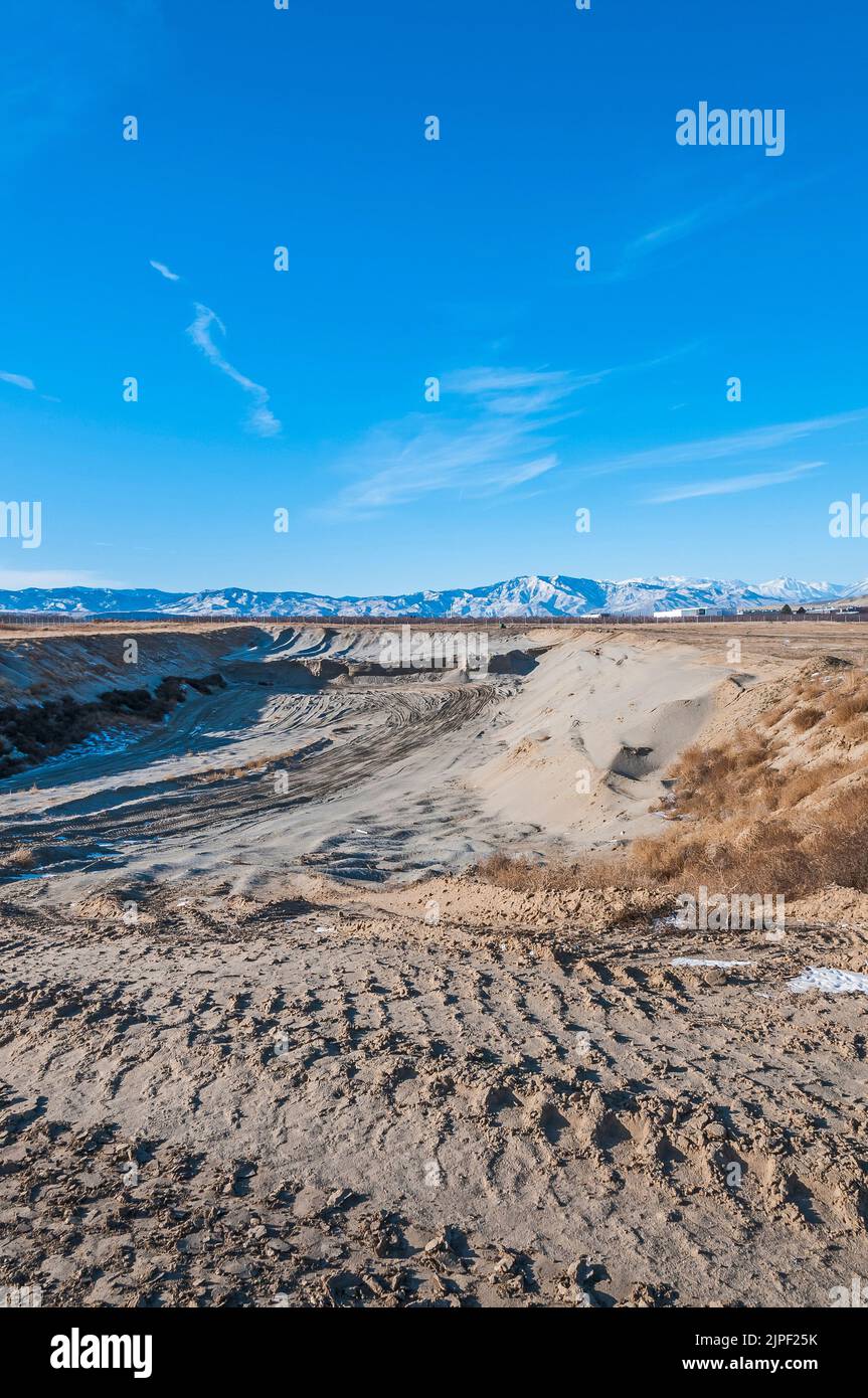 Tire and tread tracks are quite evident in the soil of an active solid ...