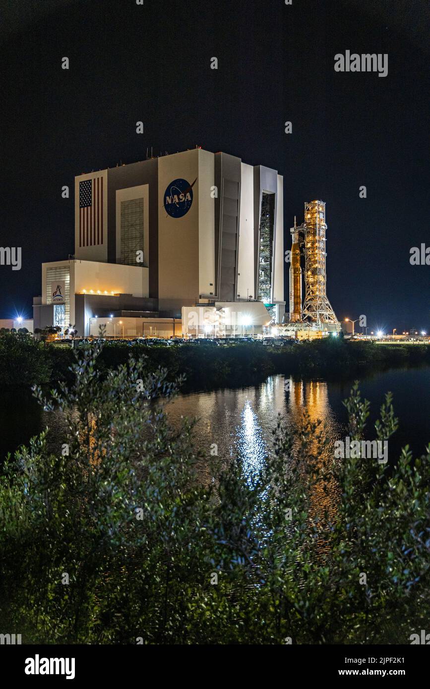 NASA’s Space Launch System sits at the Vehicle Assembly Building at the ...