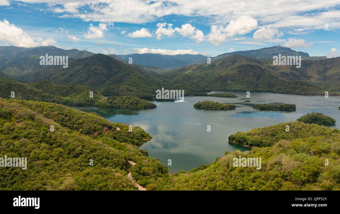 Aerial view of mountain lake among hills with tropical vegetation and ...