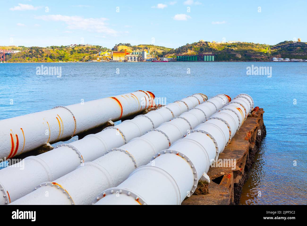 Large pipes in the river water . Pipes water supply of Lisbon city ...