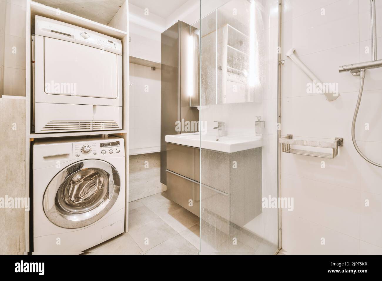 Sinks with mirrors with washing machine and shower box with glass door ...