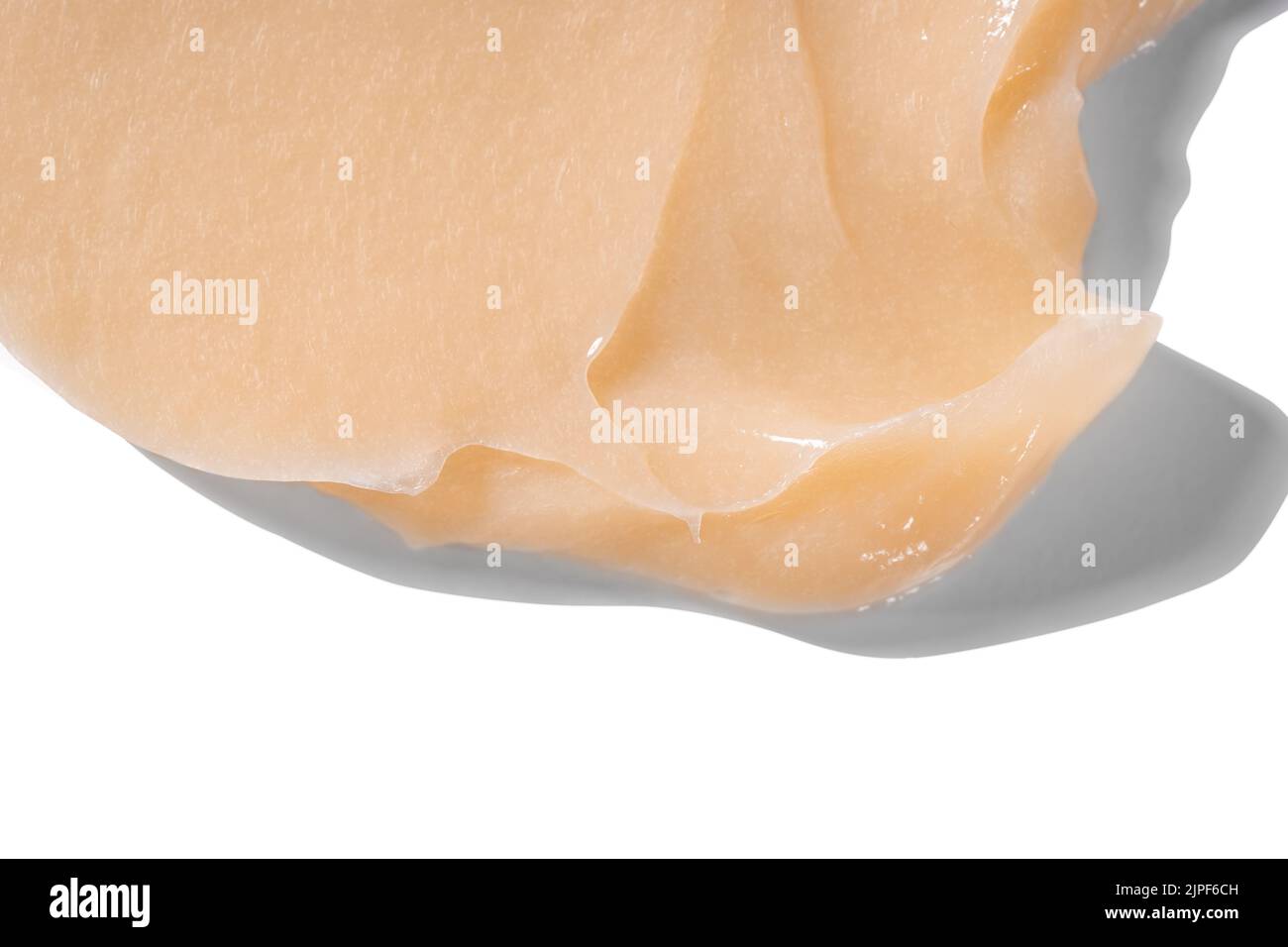 Hair conditioner cream swatch smear on white background. Yellow ...