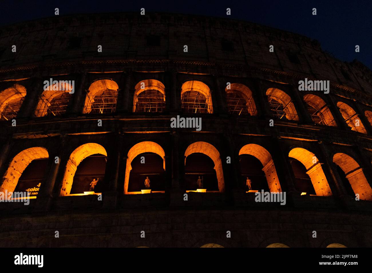 Galleries and archs of the Roman Colosseum by night, Rome Stock Photo ...