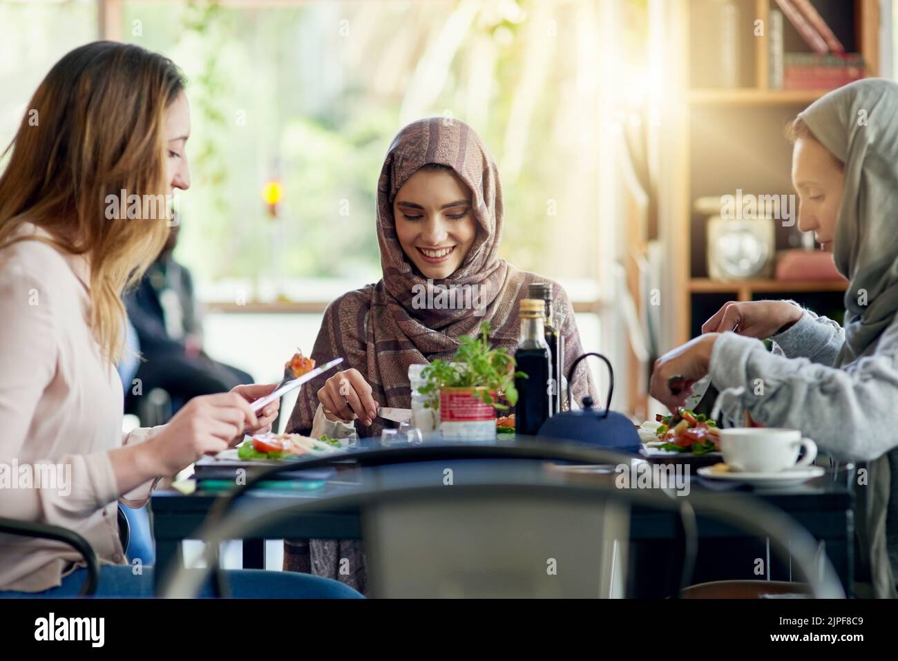 Friends who eat with you are friends for life. a group of women getting ...