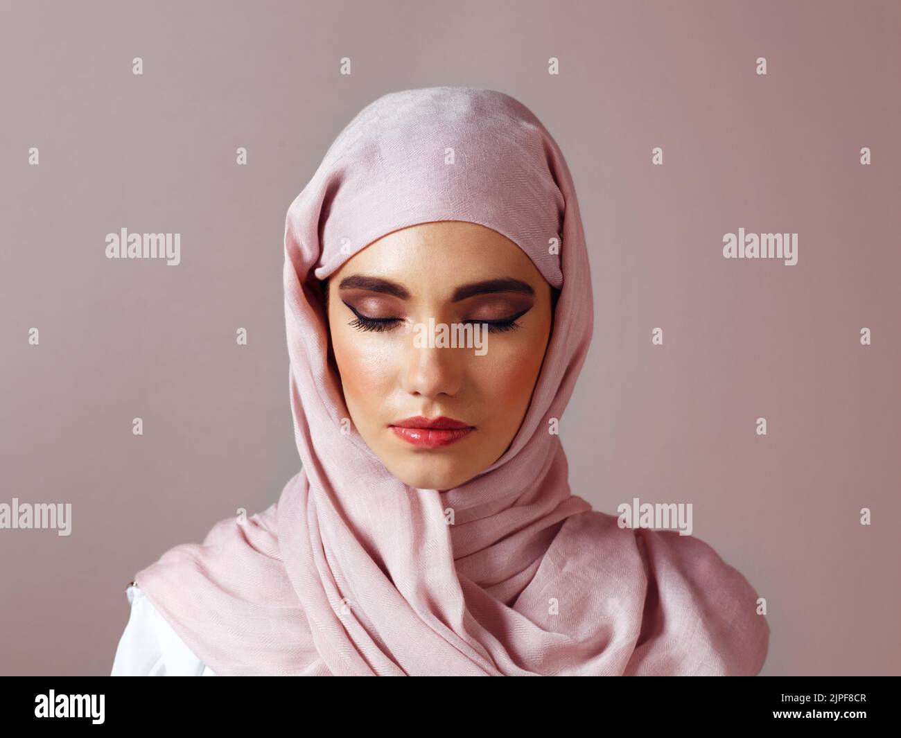 Finding her inner peace. Studio shot of a confident young woman wearing ...