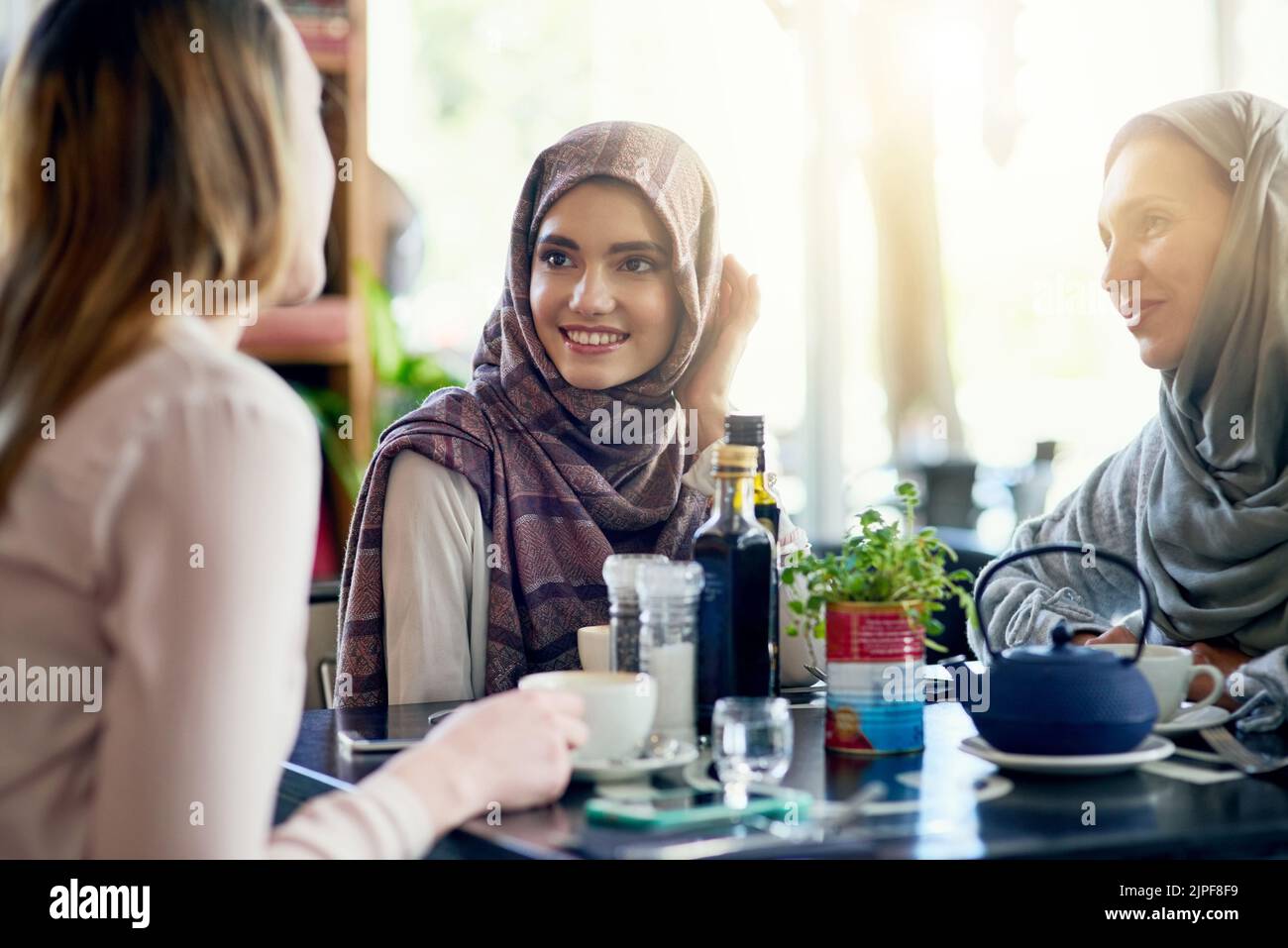 Group friends chatting in cafe hi-res stock photography and images - Alamy