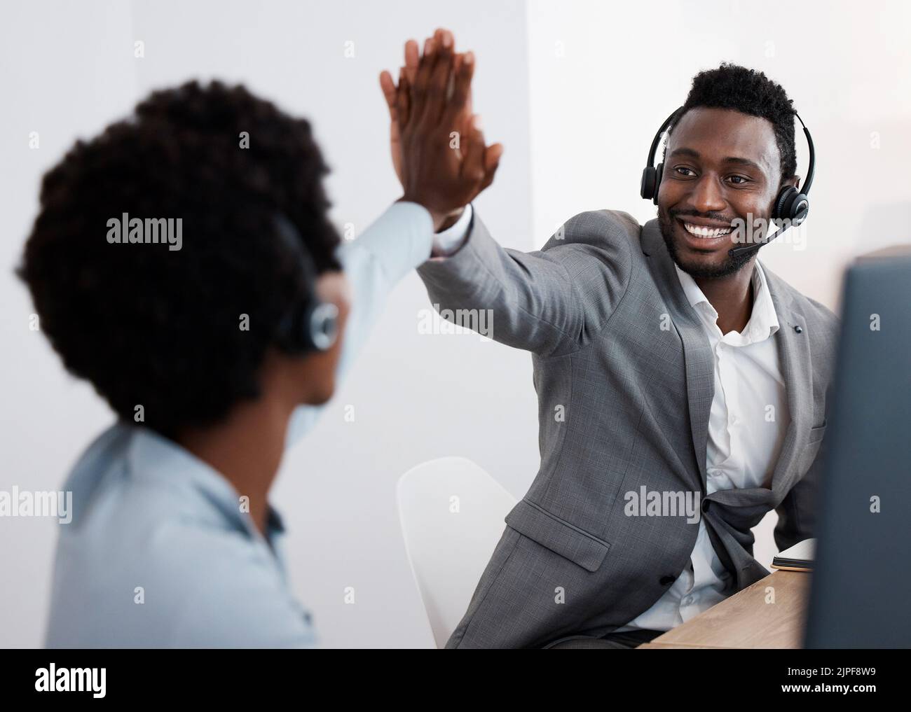 High five, congratulations and success with support staff or customer ...