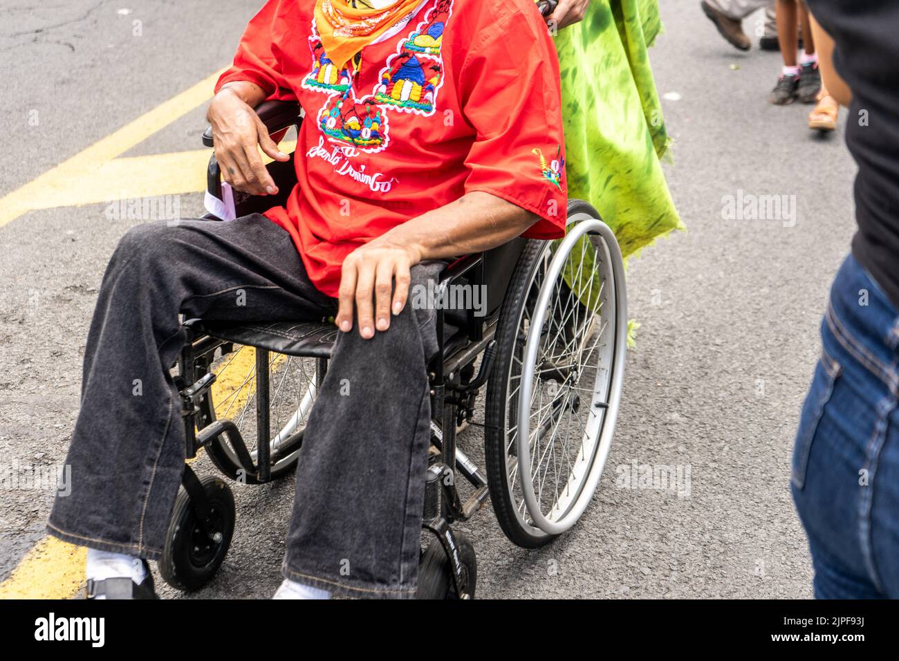 Disabled elderly man in a wheelchair in traditional clothing from ...