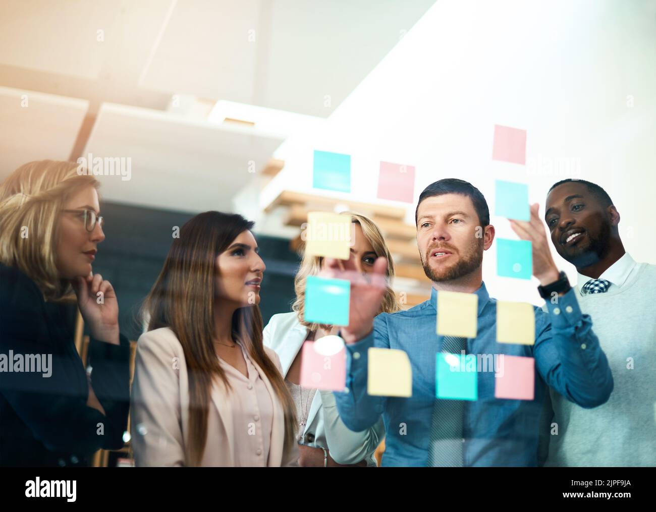 Getting those creative gears turning. a group of businesspeople ...