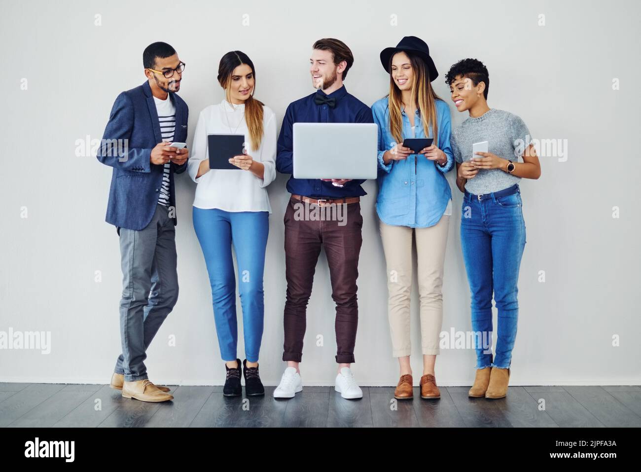 Happy caucasian female creative using hi-res stock photography and ...